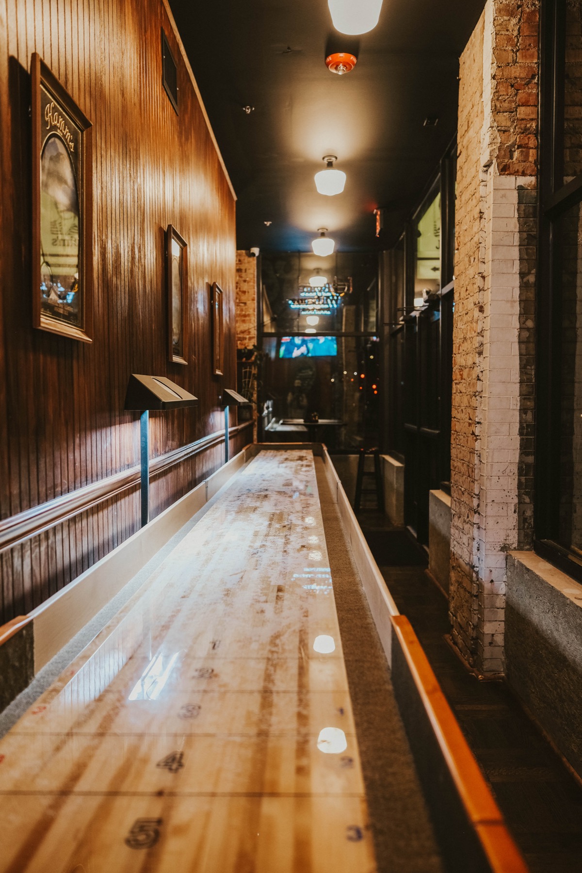 A hip KC dive is hosting a bar shuffleboard league